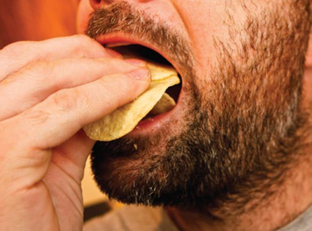 Banned from crisps at home, men eat 41% more out | News | The Grocer